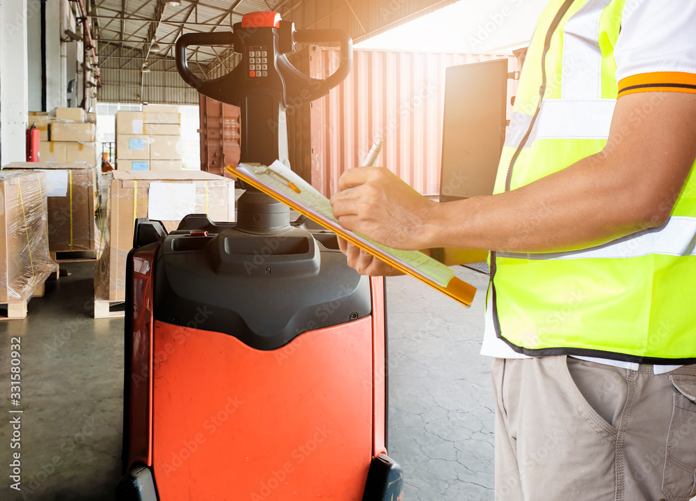 Worker Courier Holds a Clipboard Controlling the Loading of Packaging ...