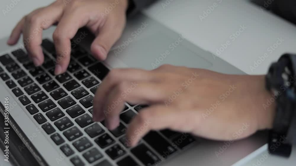 A close up of the hand of a business man on a laptop keyboard. Stock ...