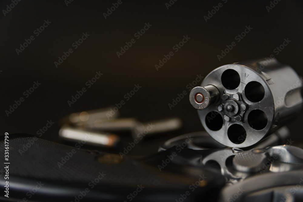 Poster 357 magnum caliber revolver pistol, cylinder open with a single ...