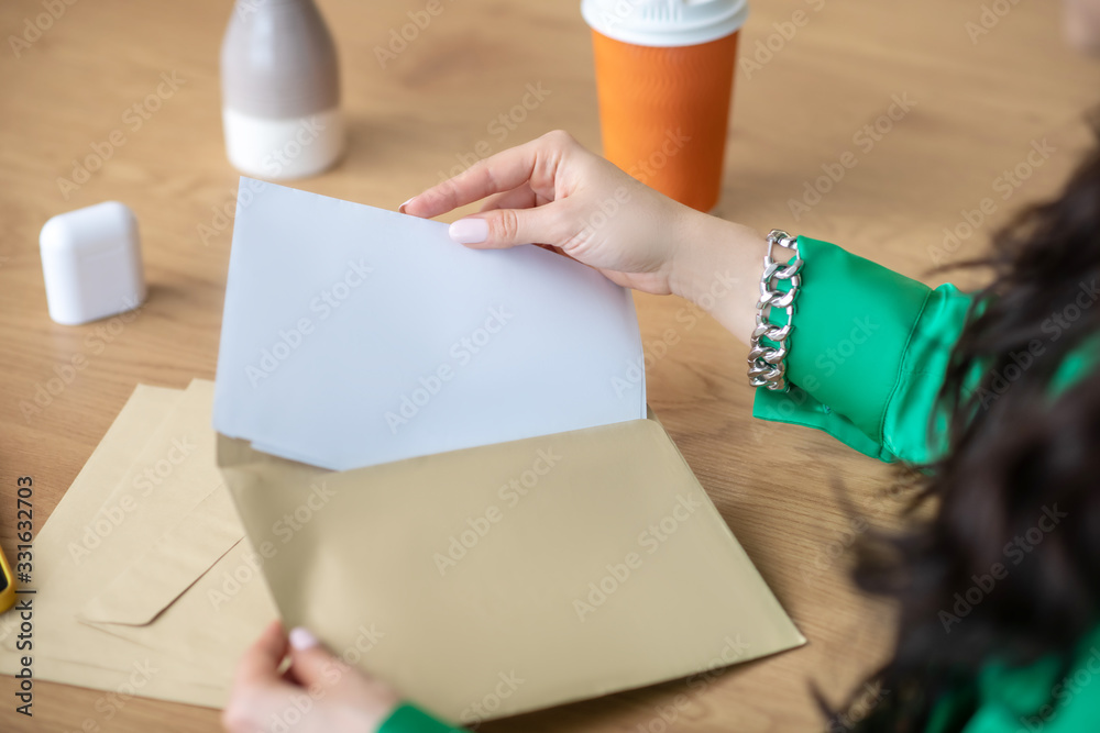 Letter and an envelope in female hands above the table. Stock Photo ...