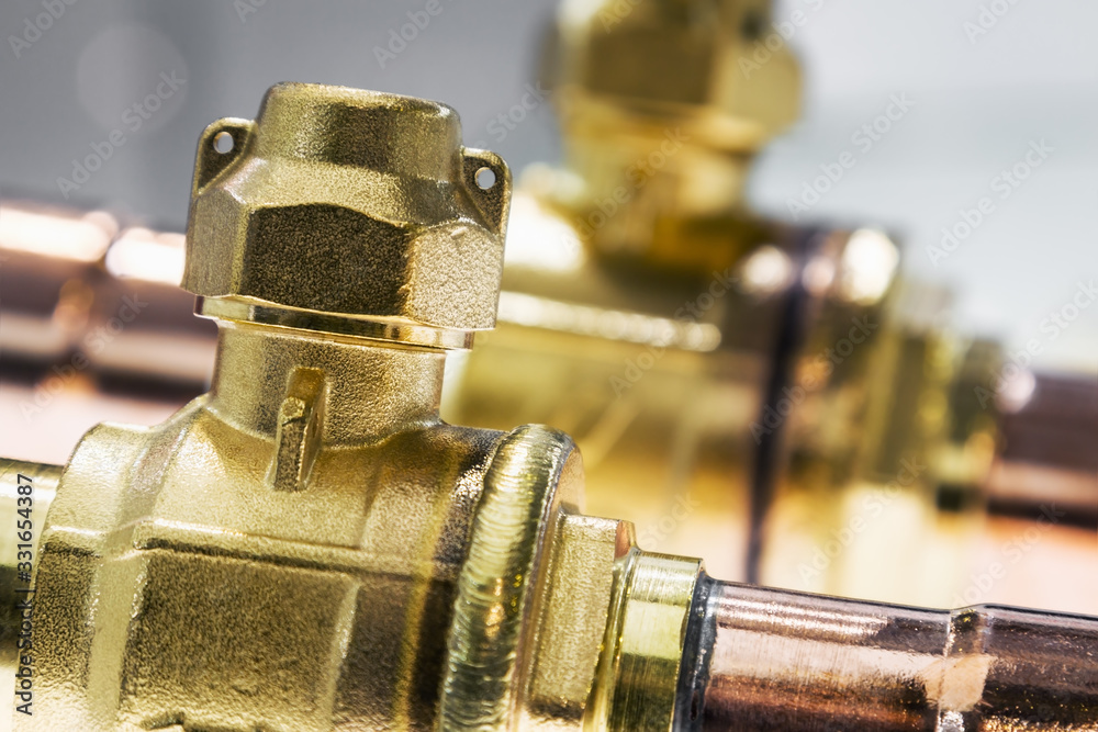 copper pipes or lines with brass exhaust valves. low depth of field ...
