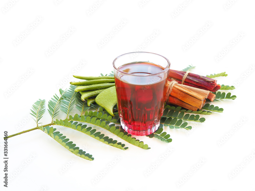 sappan water in glass with leaf on white background is a chinese herb ...