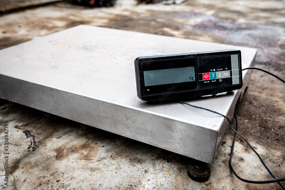 Warehouse digital platform scales on concrete background. Stock Photo ...