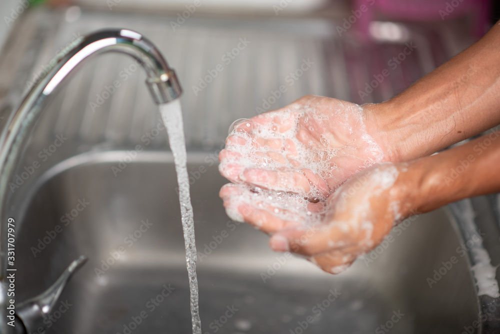 Men's hands are showing ways to wash their hands with a cleaning gel to ...