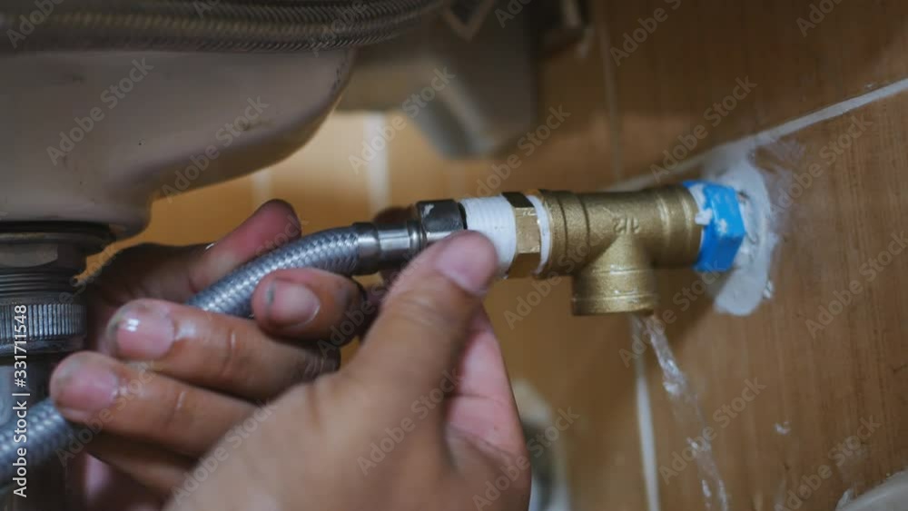 Close up of The technician is installing three-way pipes to divide the ...