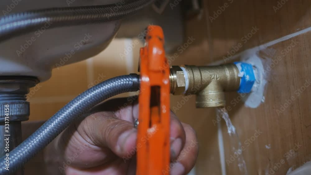 Close up of The technician is installing three-way pipes to divide the ...