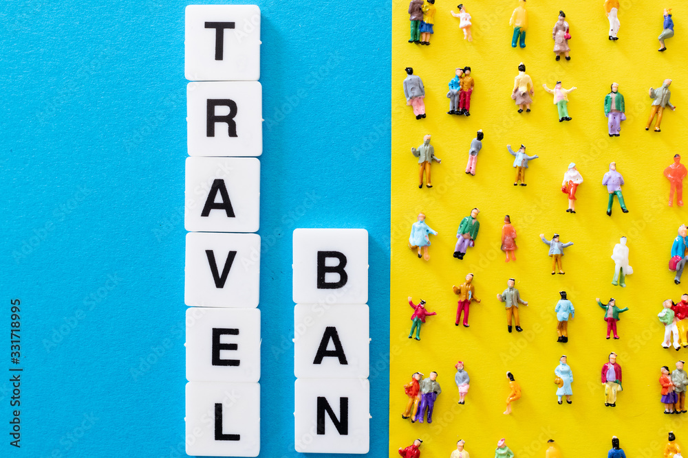 Travel ban word on a blue background and a yellow background with ...