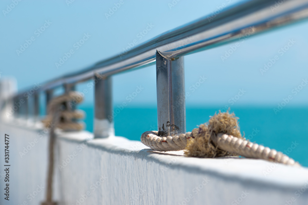 Ship railing with rope and blue sea Stock Photo | Adobe Stock