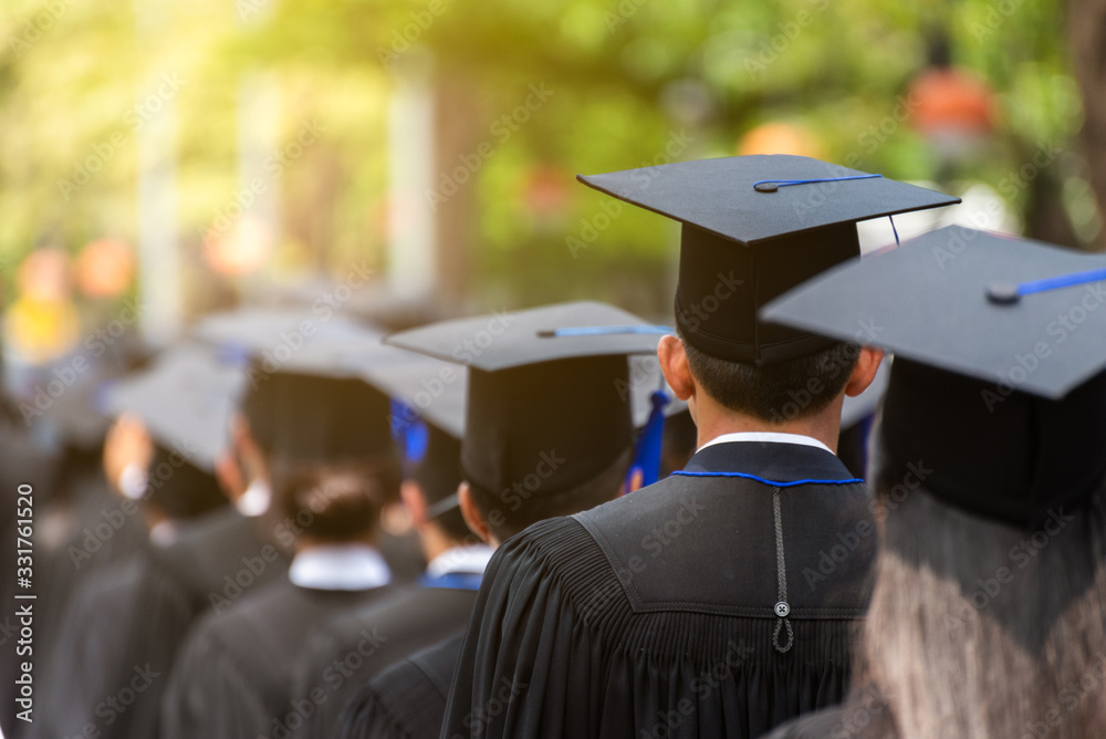 Back side view a group higher education graduation of graduates during ...
