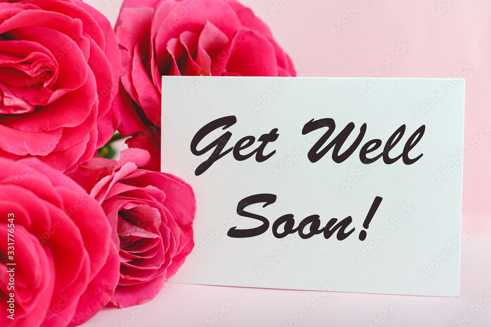 Get Well Soon card in flower bouquet on pink background. Stock photo ...