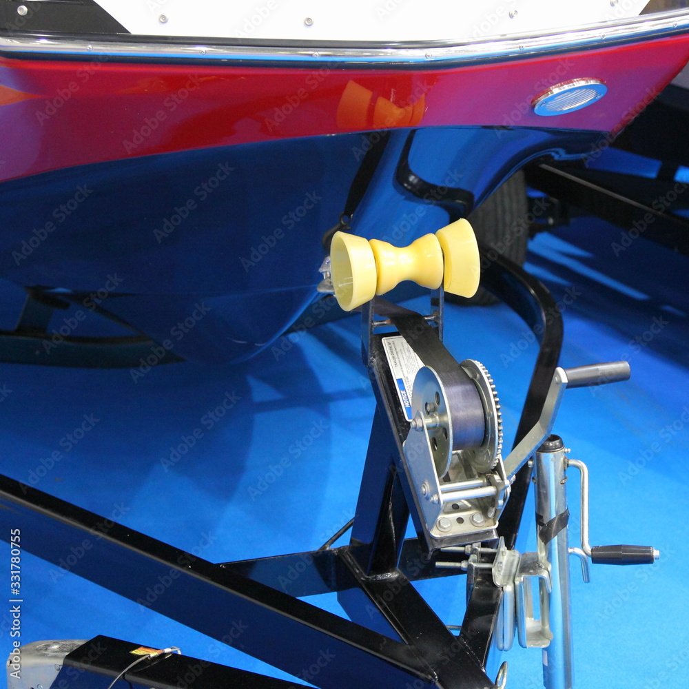Handy winch and bow thrust roller on a boat trailer with a folding ...