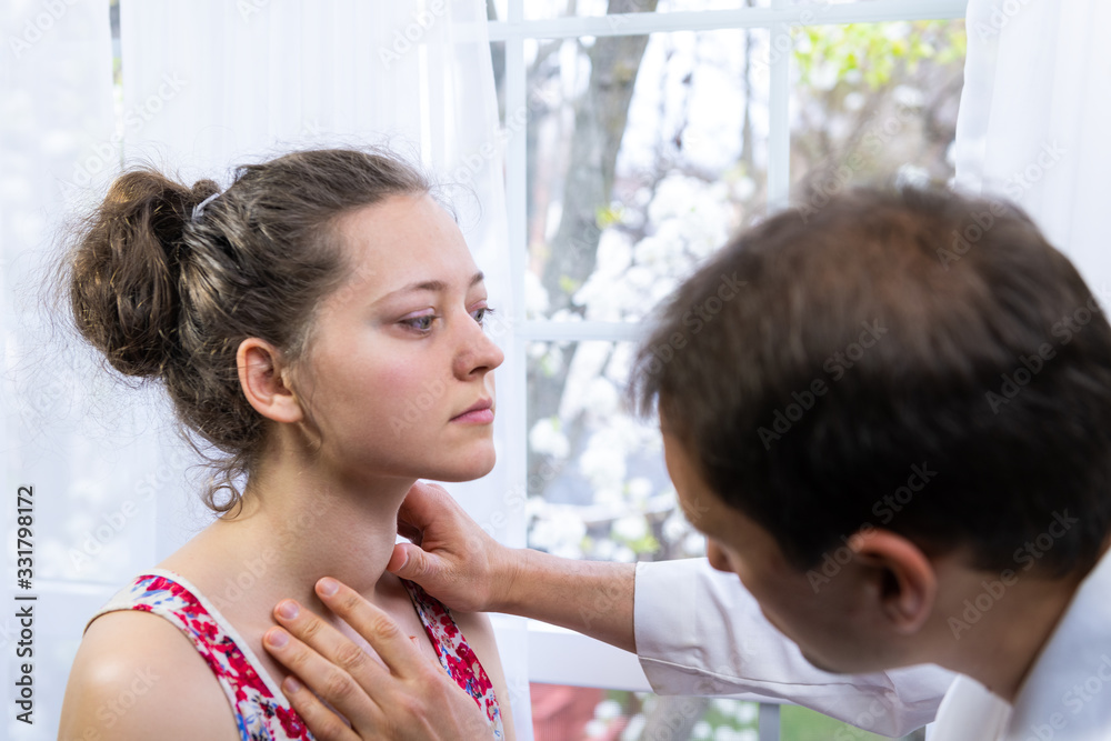 Doctor inspecting, doing palpation examination of young woman with ...