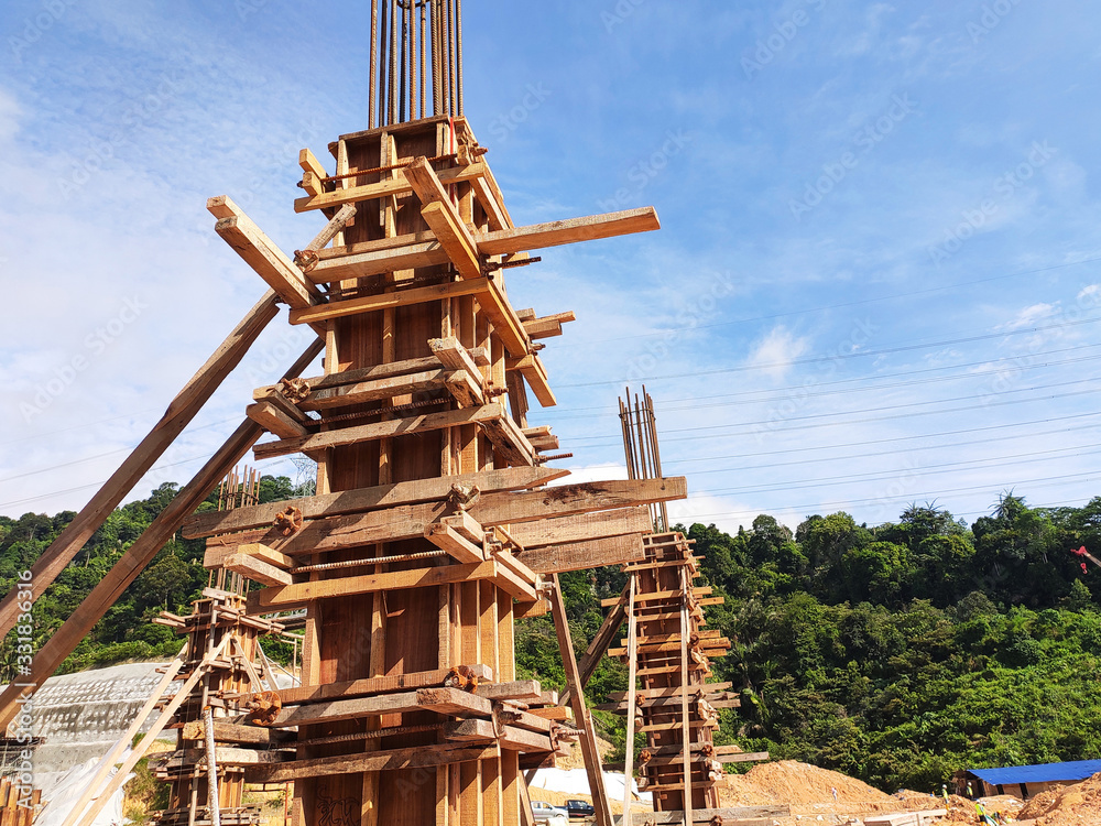 Column timber form work and reinforcement bar at the construction site ...