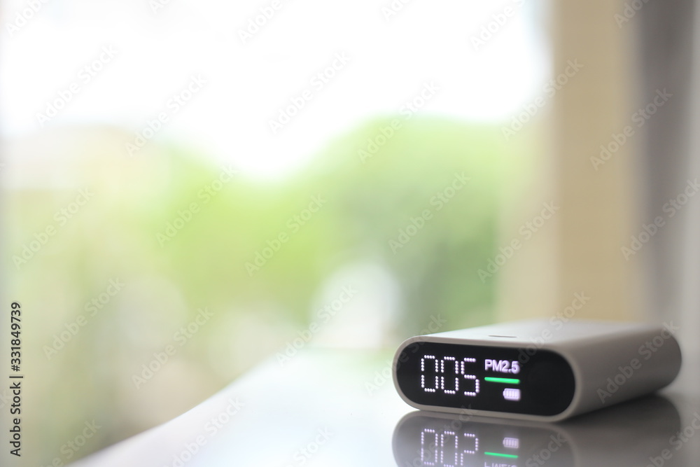 PM 2.5 dust detector and green bokeh background. particulate matter ...
