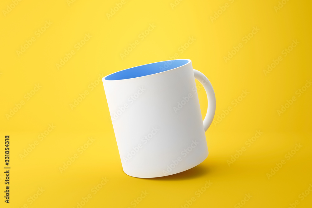 Classic white mug and blue inside on vivid yellow summer background ...