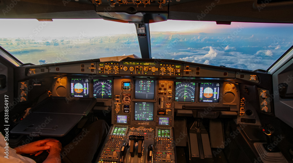 Sunset in the flightdeck of the Airbus A320 Stock Photo | Adobe Stock