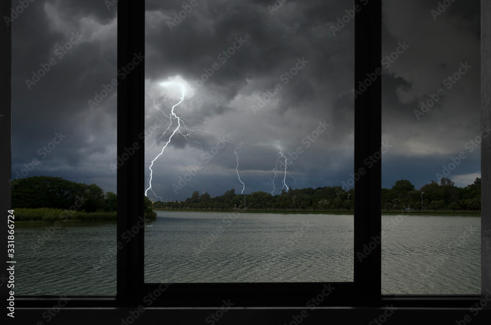 Scared lightning strikes over the forest and river Stock Photo | Adobe ...