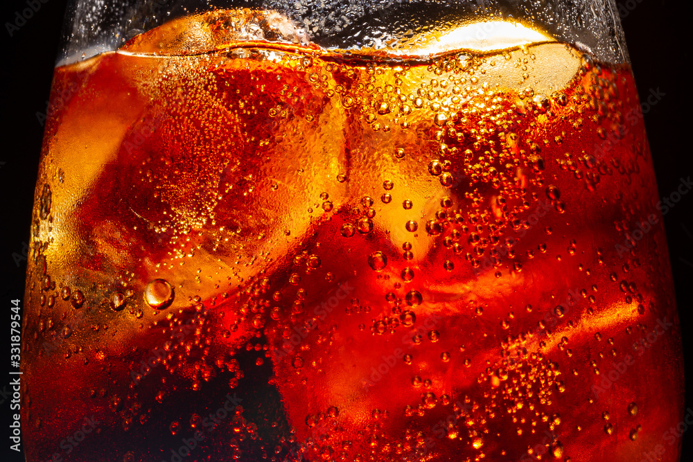 Background of cola with ice and bubbles. Side view background of ...