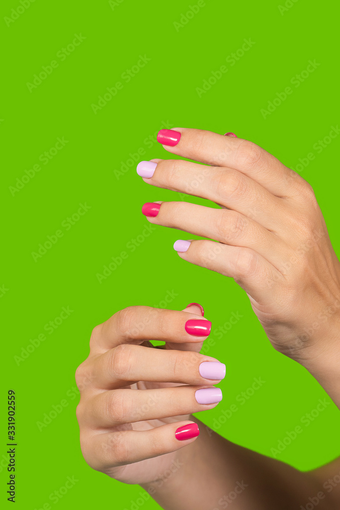 Vertical color photography of two manicured female hands isolated on ...
