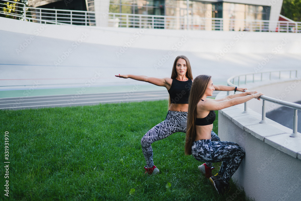 Sports and fitness outside the gym. Young fit women with perfect bodies ...