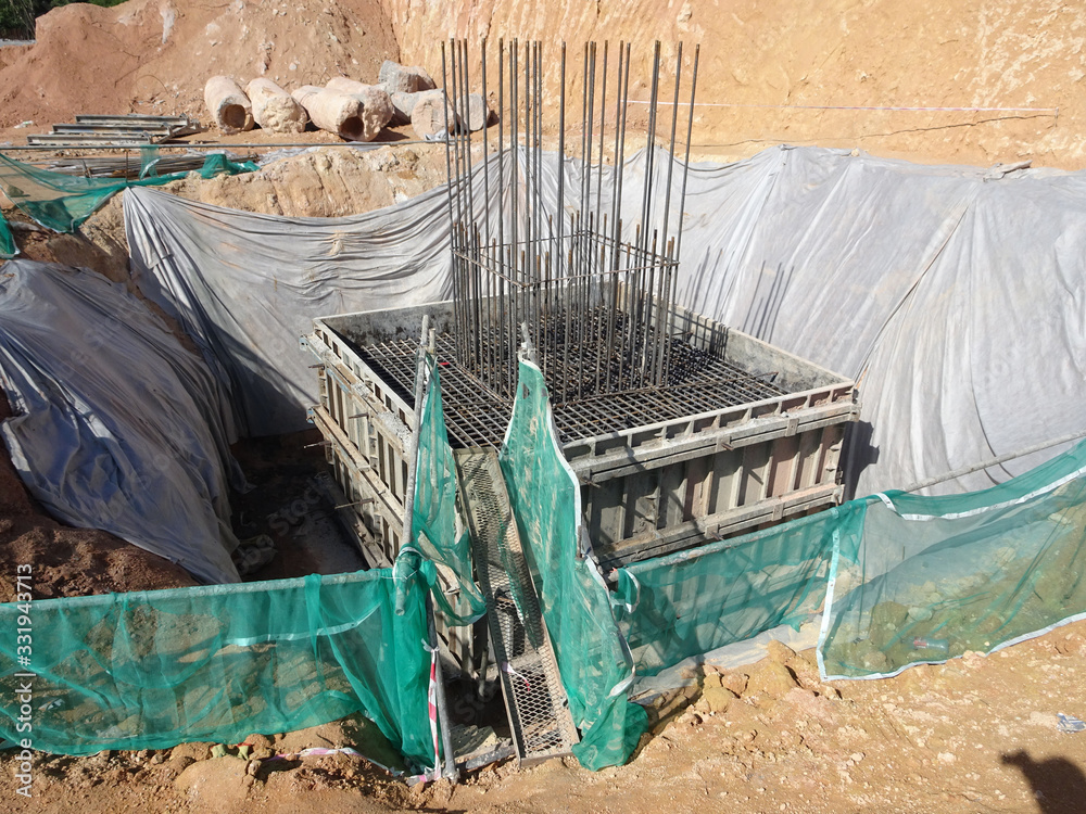 Pile cap and column stump under construction at the construction site ...