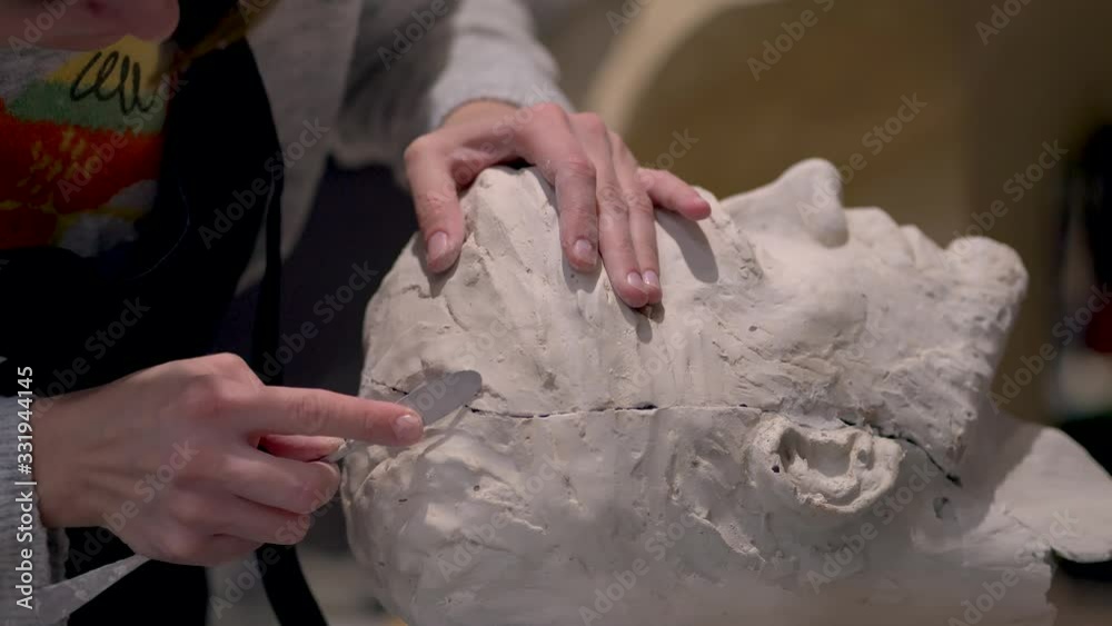 The process of creating sculpture. The sculptor is working. Plaster ...