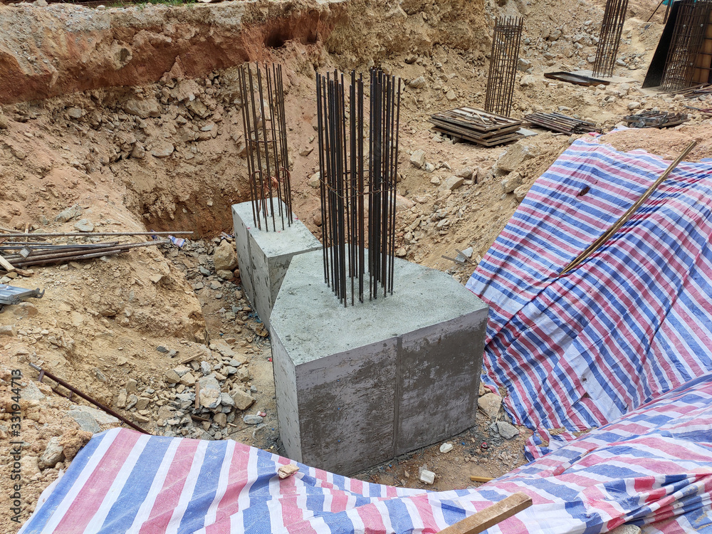 Pile cap and column stump under construction at the construction site ...
