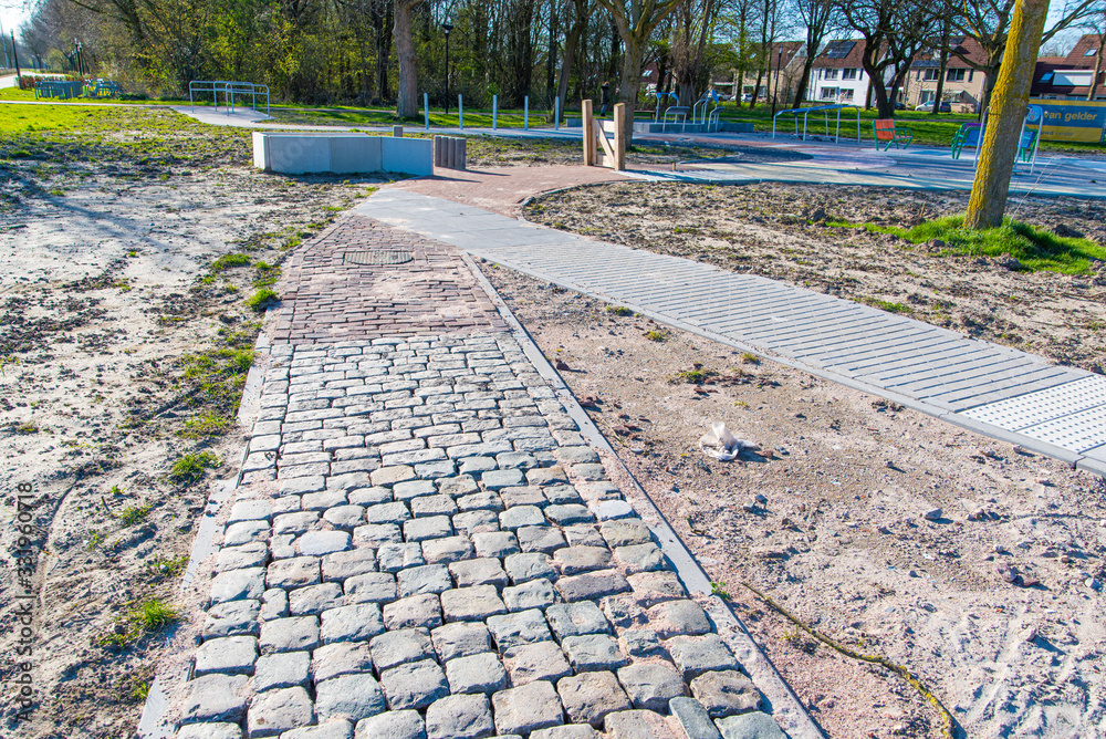 an exercise park. In the park, wheelchair users, walker users and ...