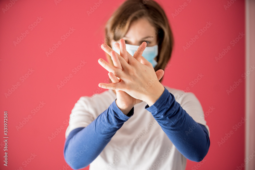 nurse with surgical mask shows how to properly wash your hands with gel ...
