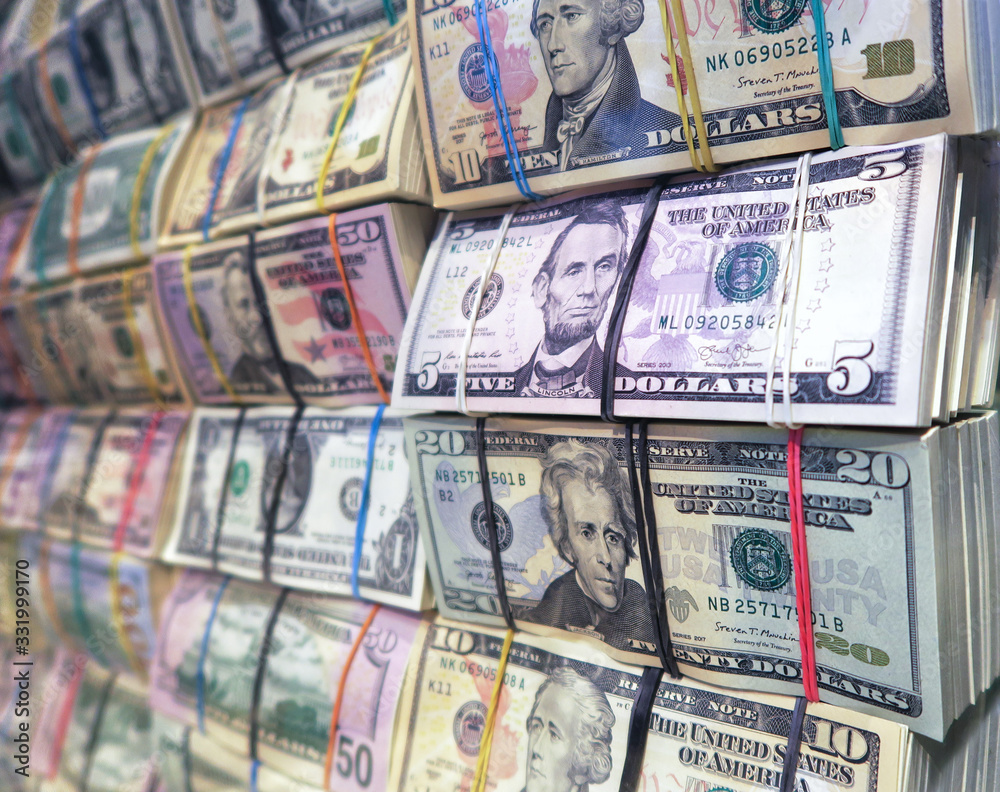 Detailed snapshot of a stack of us dollars and euros. Background of ...