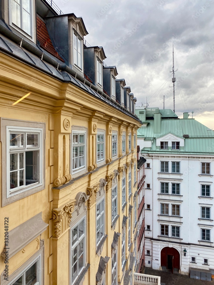 old houses in the city of vienna austria, yellow house with green ...