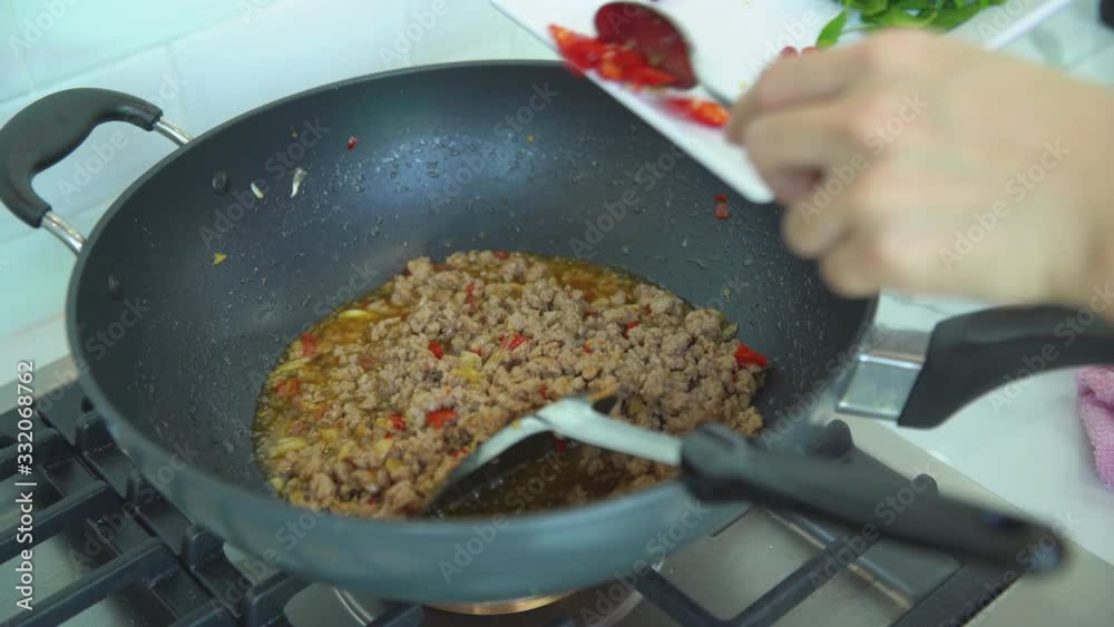 Chef Hand Cooking Stir-Fried Beef and Holy Basil. cooking Pad Kra Pao ...