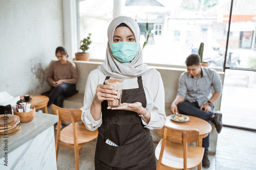 muslim worker wearing masks while working in coffee shop Stock Photo ...