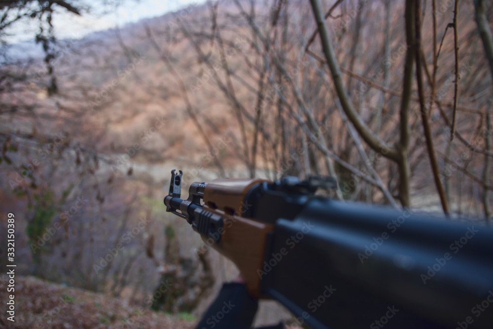 Shooter aiming target with assault rifle weapon. dangerous bandit ...