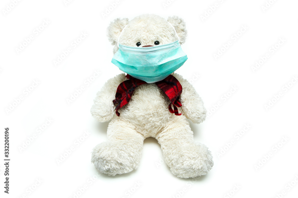 The plush teddy bear with a mask on his face as a symbol of protection ...
