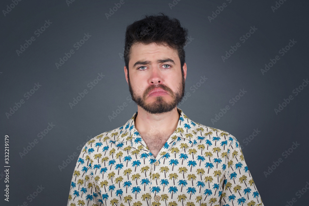 Beautiful face of sad man crying desperate and depressed with tears on ...