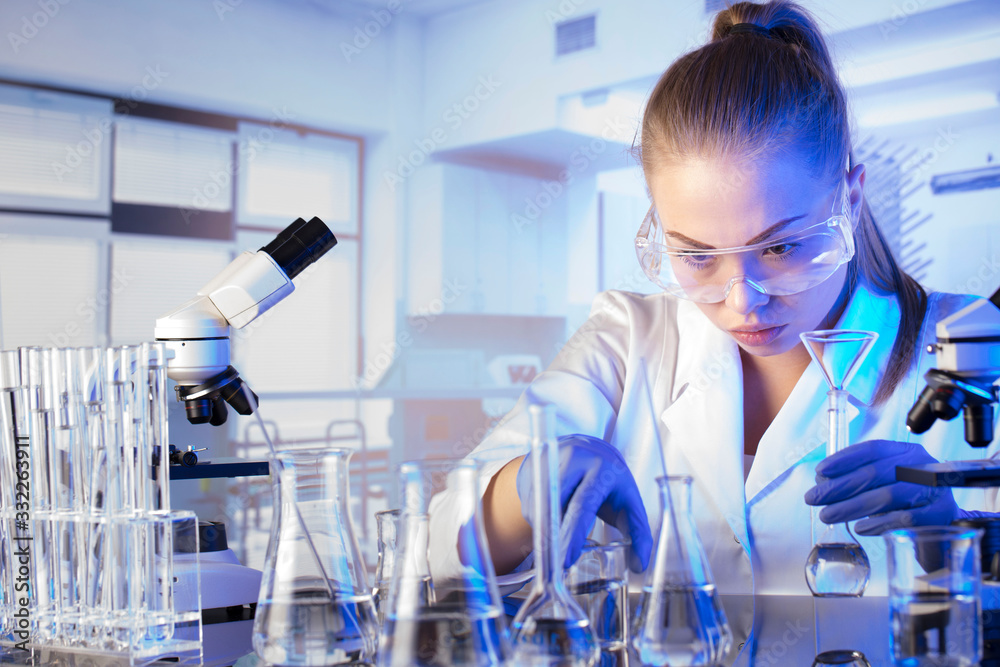 Laboratory interior. Science research concept. Young scientist during ...