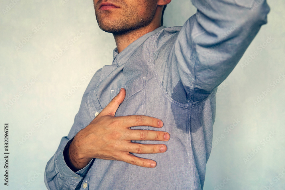 wet spot on my blue shirt from sweat. Young man with sweating under ...