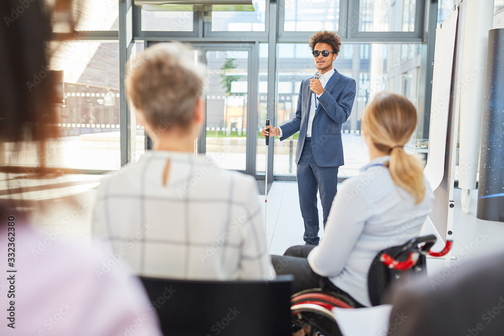 Blind man as speaker at a conference on inclusion Stock Photo | Adobe Stock