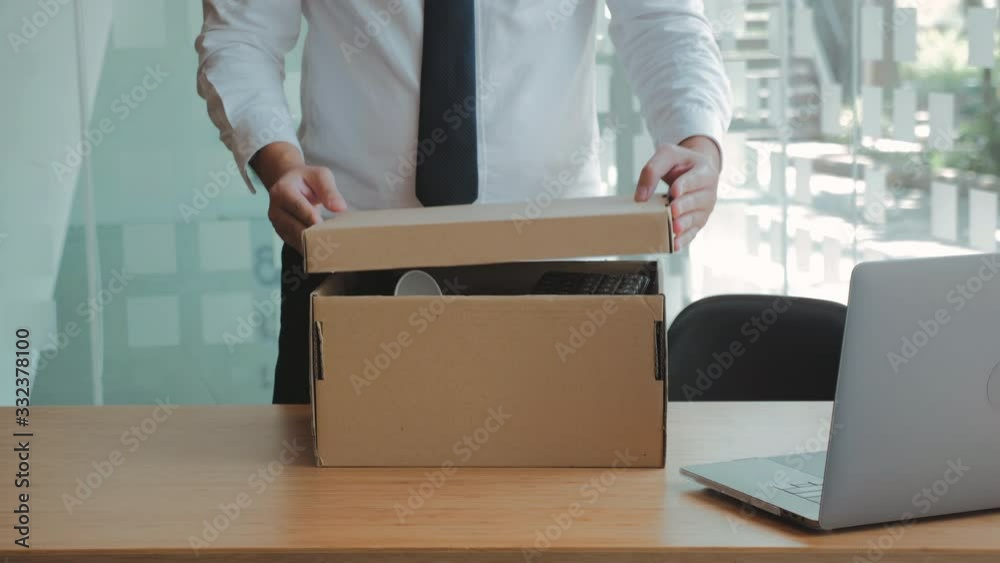 Business man stressing with resignation letter for quit a job packing ...