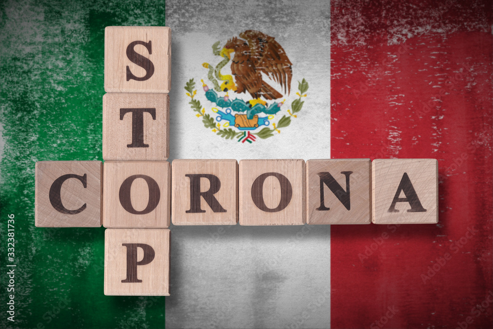 Flag of Mexico with wooden cubes spelling STOP CORONA on it. 2019 ...