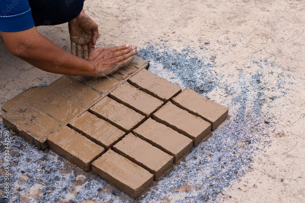 Hands of male worker were to spread the mud to mold (4 piece / mold ...