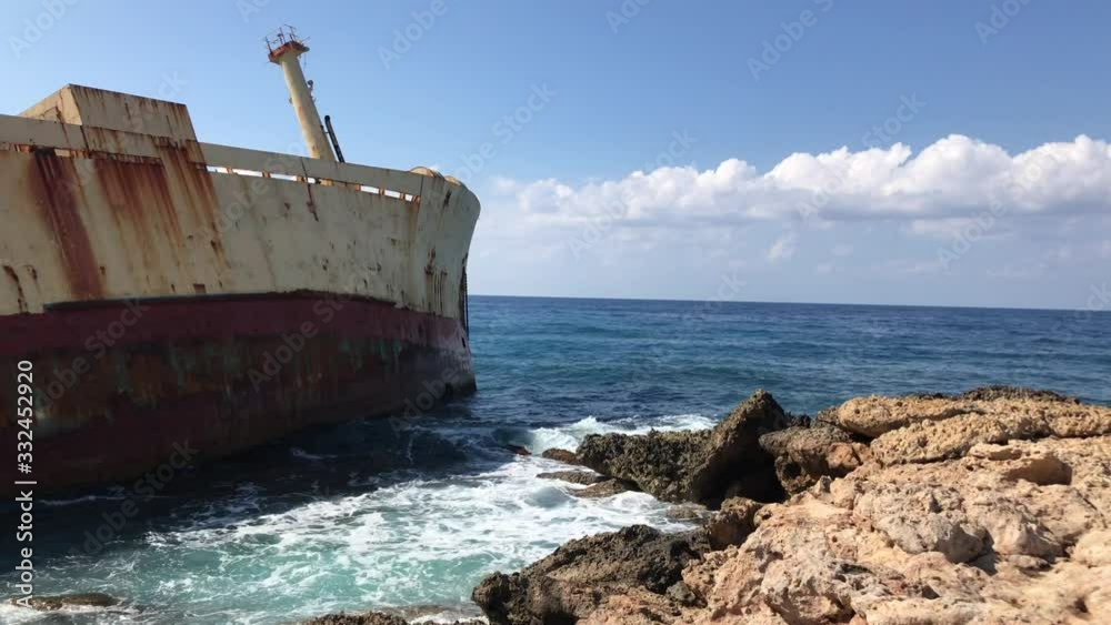 The sea waves beat against the abandoned merchant ship in the Cyprus ...