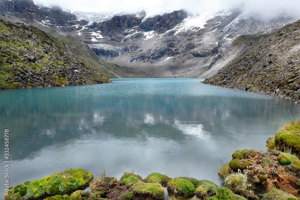 Pure lagoon at the feet of the snowy verdish 2 with a view of moss ...