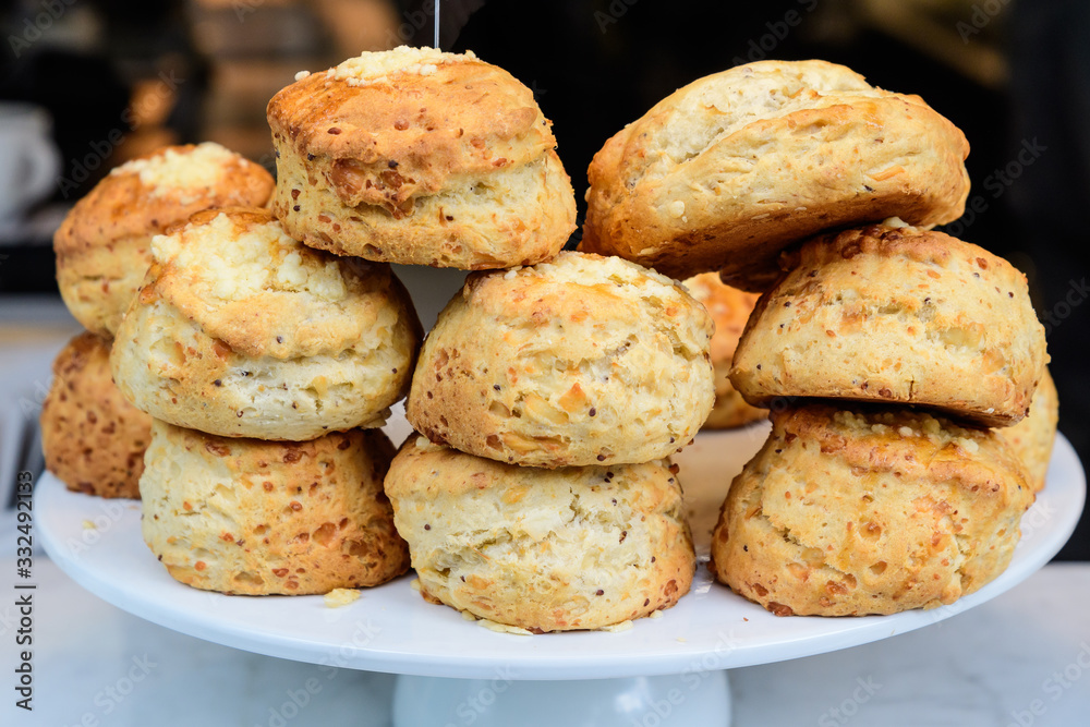 Freshly baked homemade English scones with dried fruits, displayed as a ...