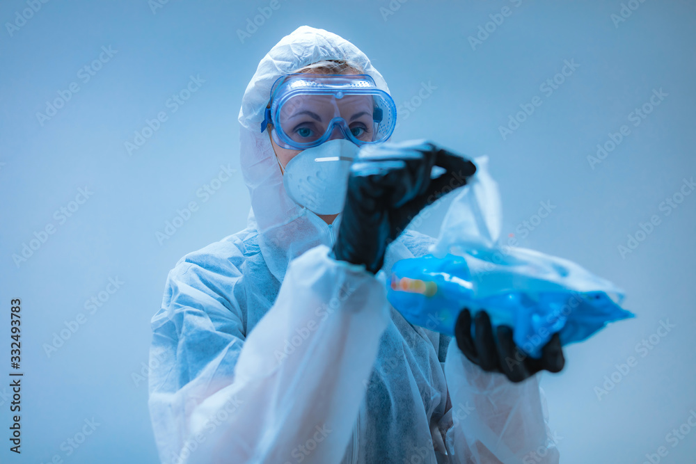 Medical doctor, scientist in full body suit for prevention from viruses ...