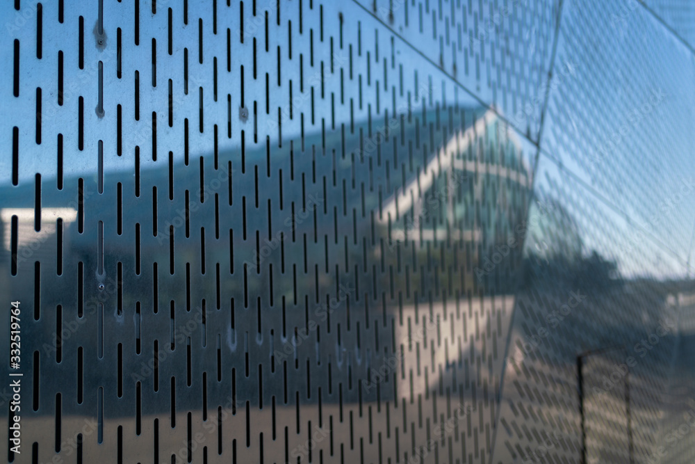 reflective metal plate with ventilation holes. In architectural forms ...