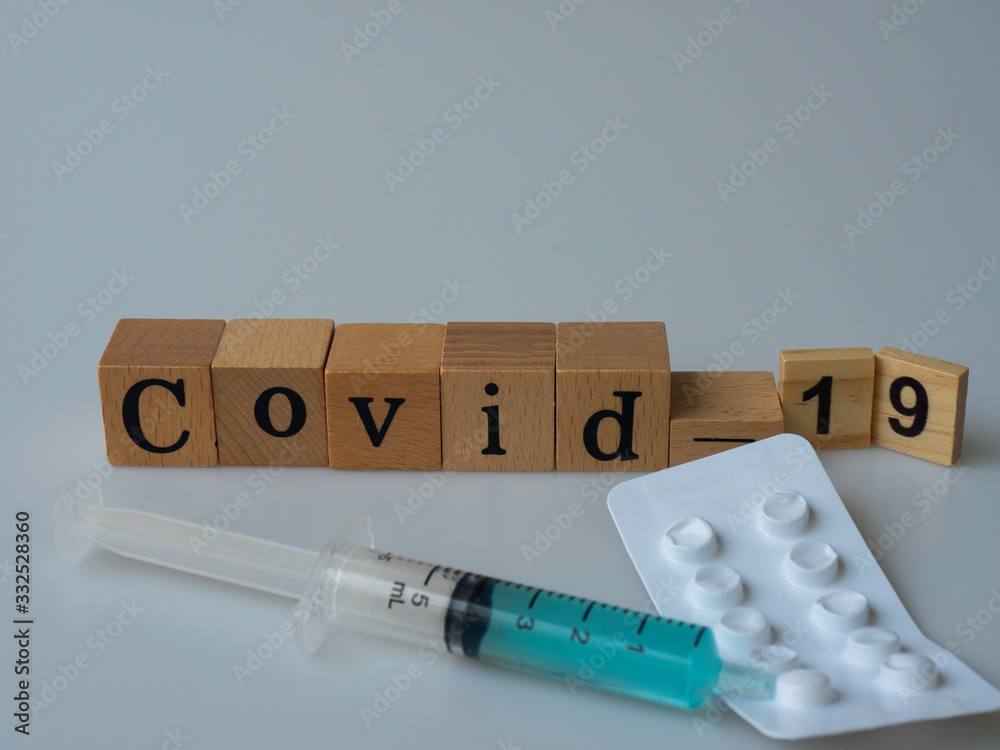 The printed COVID-19 disease blocks are made from wood being on white ...