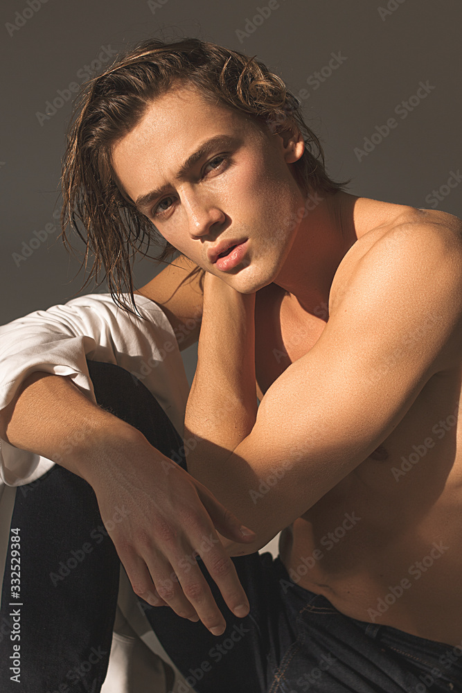 Muscle strong face beautiful stripped male model portrait in denim blue ...