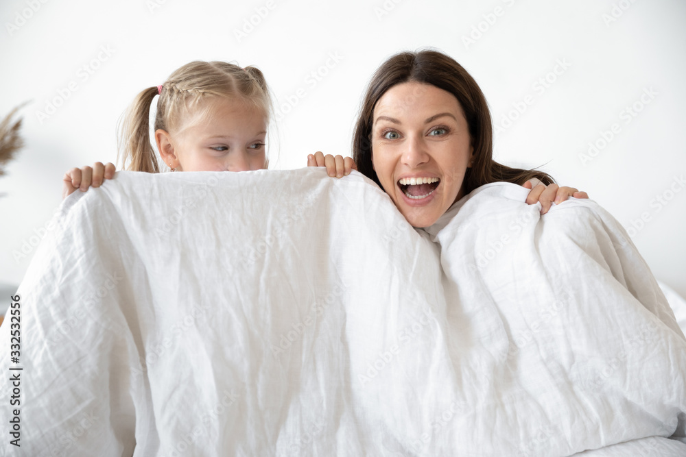 Child Hiding Behind Mother